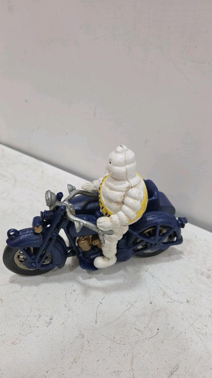 Lot 643 - CAST MICHELIN MAN ON MOTOR BIKE AND SIDECAR